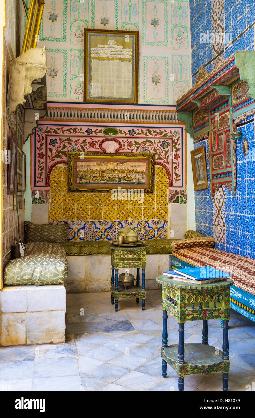 The scenic interrior of tea room decorated with glazed tiles in Dar ...