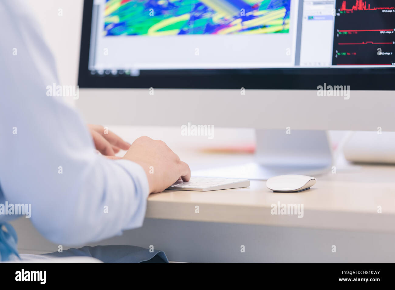 Woman sitting at desk and working at computer hands close up Stock ...