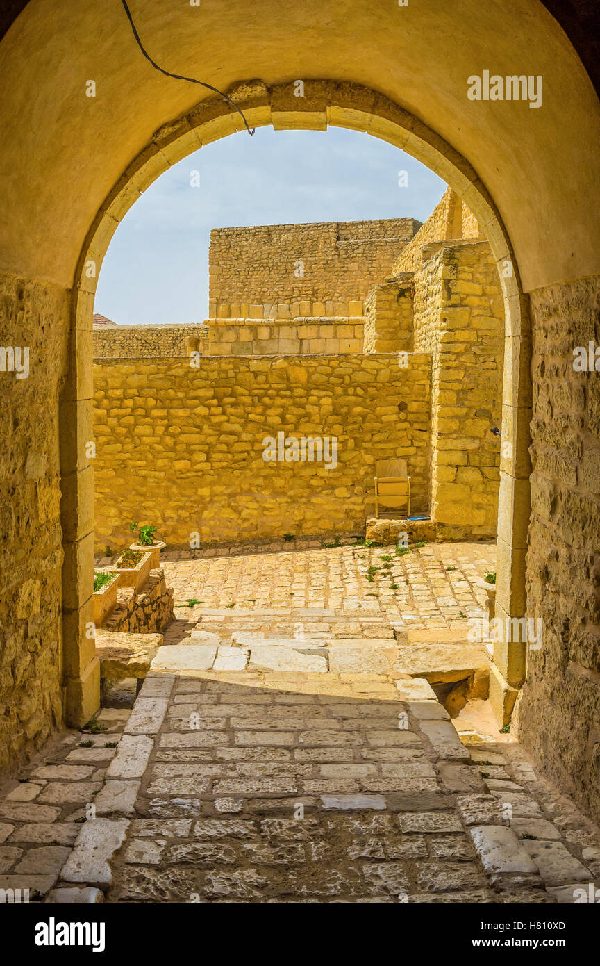 The covered arched pass connects the different buildings in Kasbah of ...