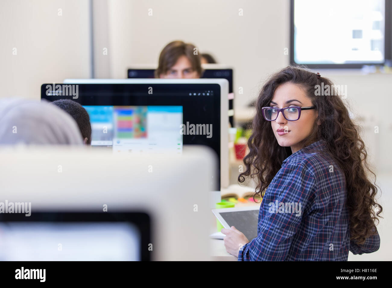 Group of entrepreneurs working using a computer Stock Photo - Alamy
