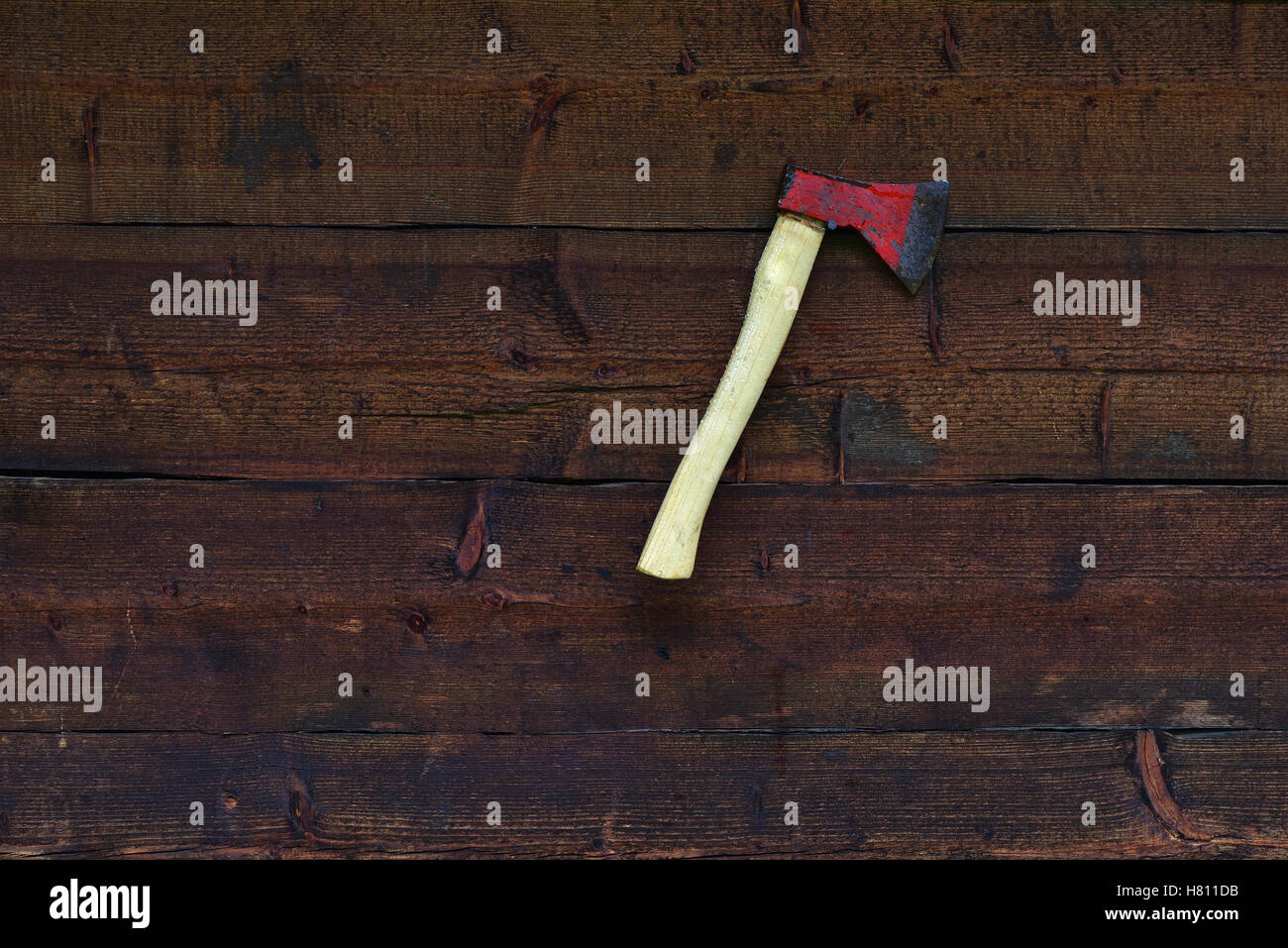 Vintage ax hanging on a wet wooden wall in a rainy day Stock Photo - Alamy