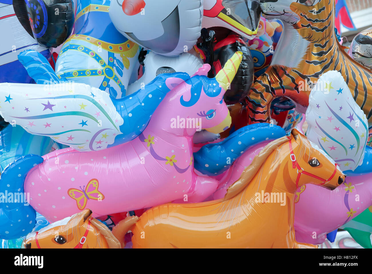 Funny balloons of different shapes and colors Stock Photo - Alamy