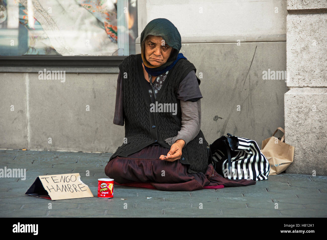 Old woman begging on street Stock Photo - Alamy