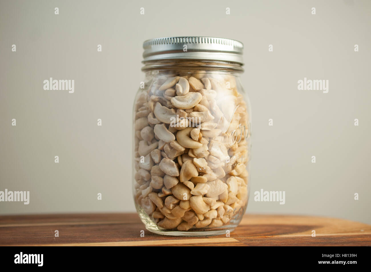 A single glass mason jar full of cashew nuts Stock Photo - Alamy