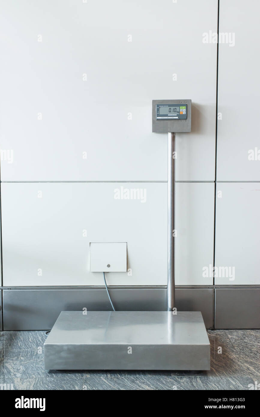An airport self service check in booth/kiosk with attached baggage ...