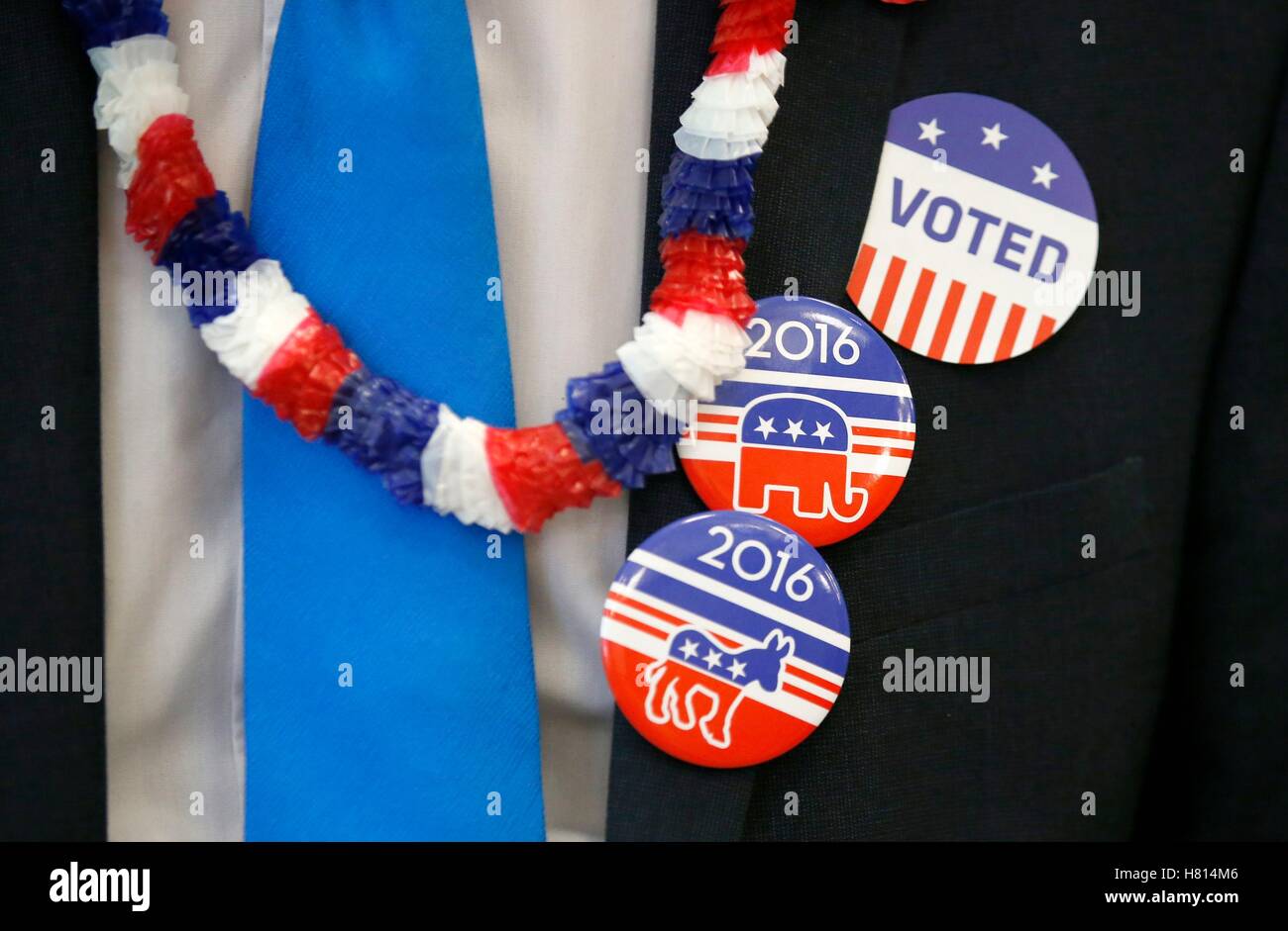 A student wears election pin badges at a US election party at the ...