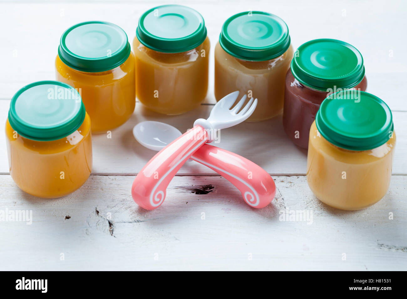 healthy ready-made baby food on a wooden table Stock Photo - Alamy