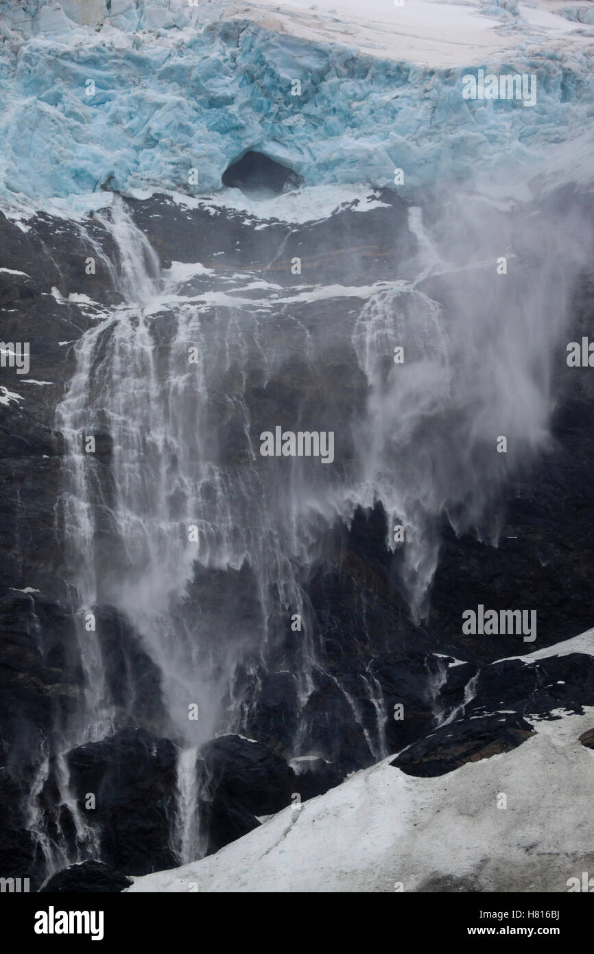 Wind blowing waterfall upwards, water flowing from glacier above ...