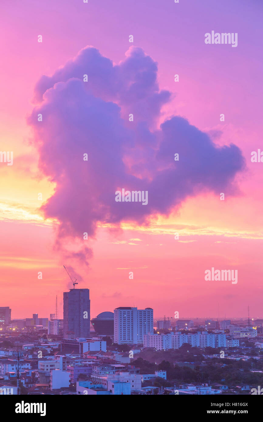 Strange smoke floating over building in Bangkok during twilight after ...