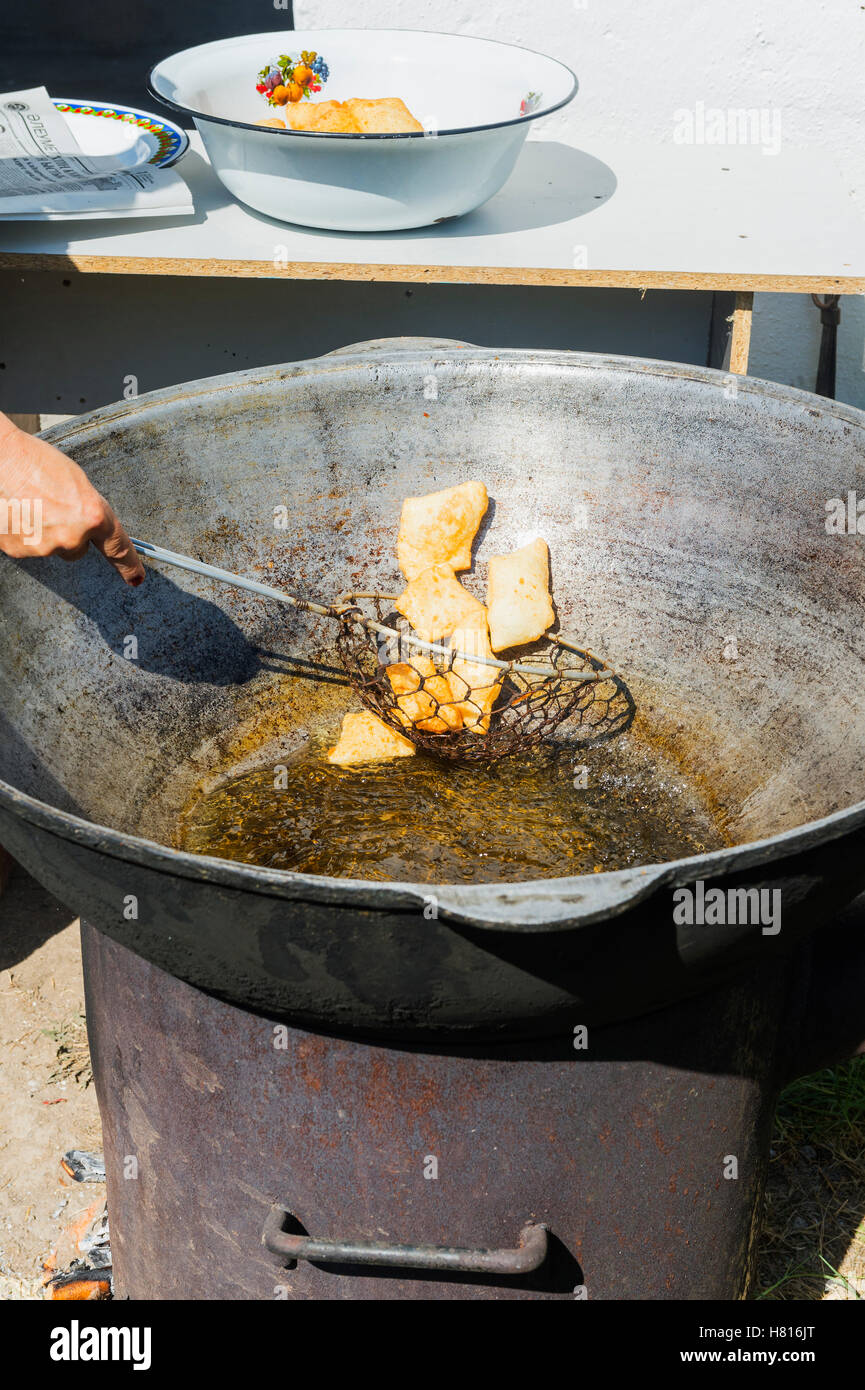 Kazakh Woman preparing the traditional local tandyr bread, Shymkent ...