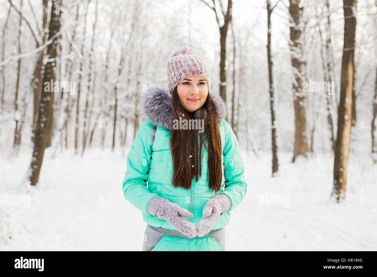 Girl in winter snowy park. Snow, cold and seasonal concept Stock Photo ...