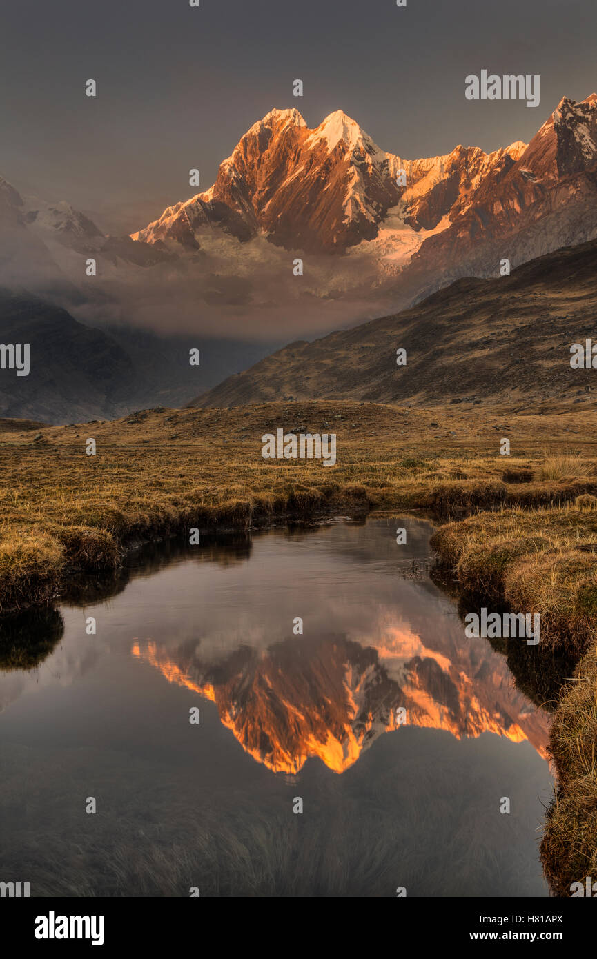 Jirishanca peak, 6090 meters, dawn reflection in stream running into ...