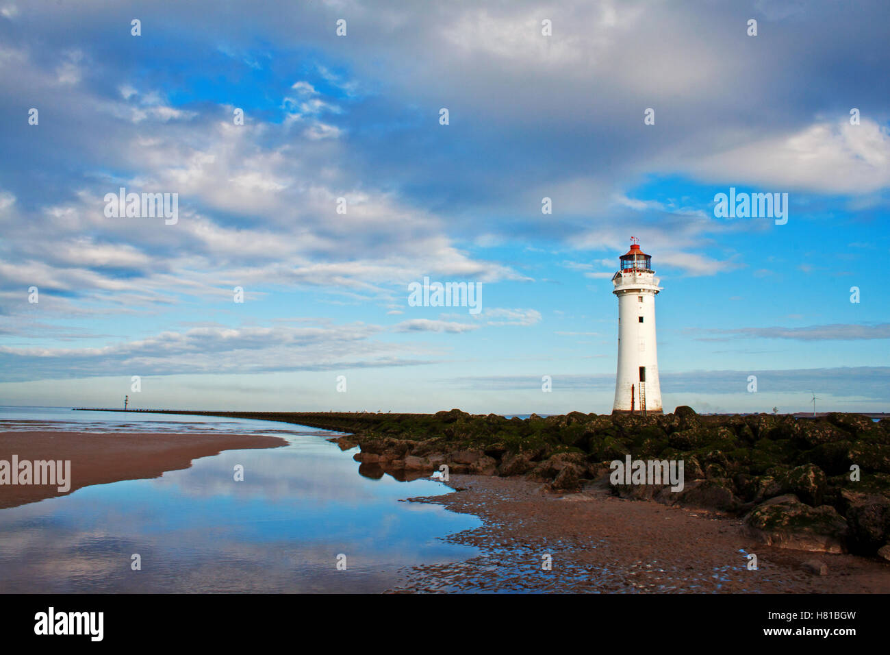 Perch Rock Lighthouse and New Brighton sea defenses Stock Photo - Alamy