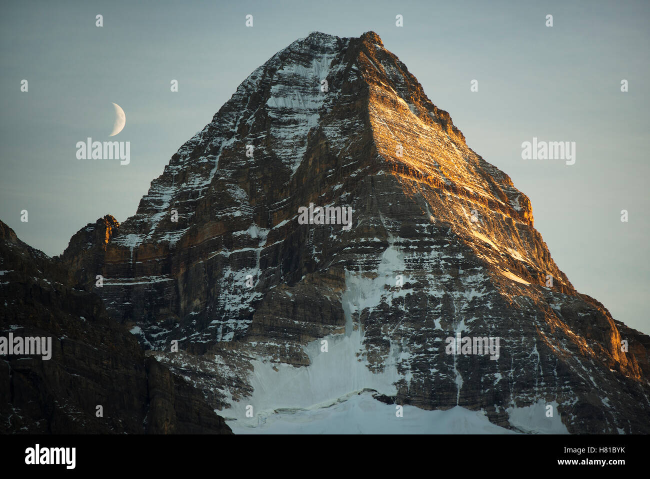 Crescent moon and summit of Mount Assiniboine, Mount Assiniboine ...