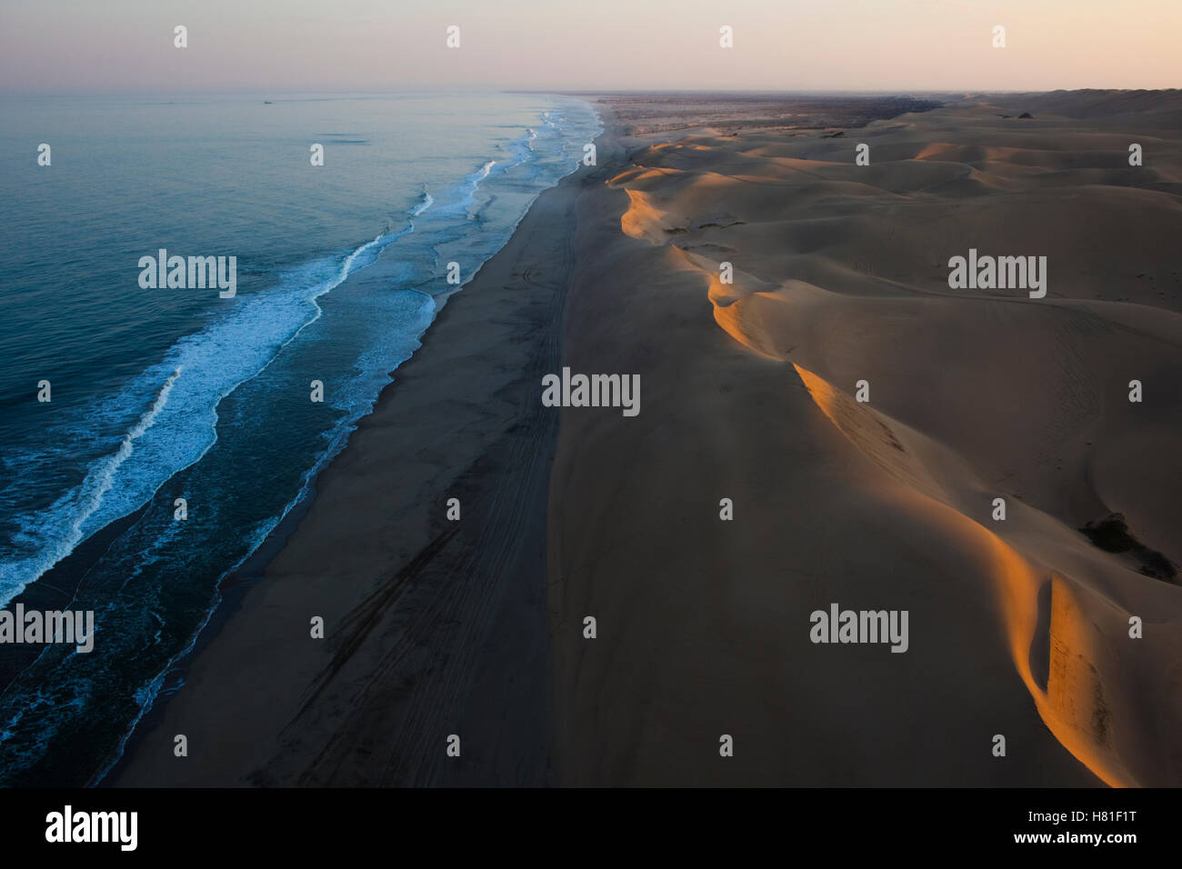 Sand dunes and Pacific Ocean south of Walvis Bay, Namib Desert, Namibia ...