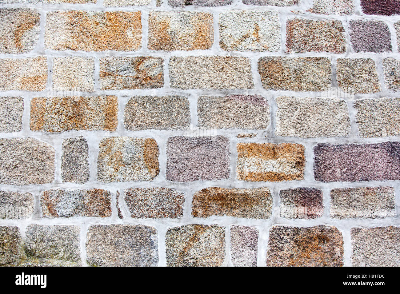 Colorful stone wall background Stock Photo - Alamy