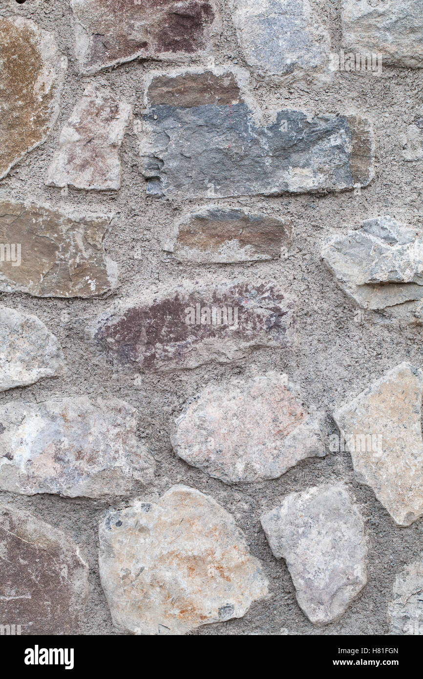 Round stones wall background Stock Photo - Alamy