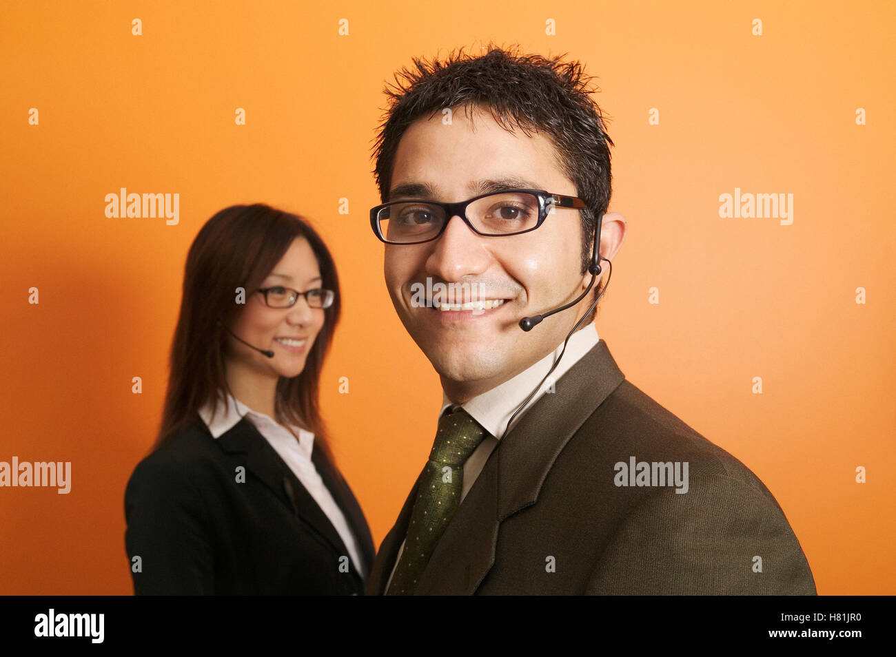 Male and female with telephone headsets on Stock Photo - Alamy