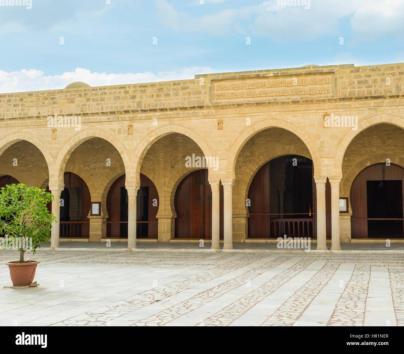 The old stone arcade in front of the prayer hall of the Grand Mosque ...