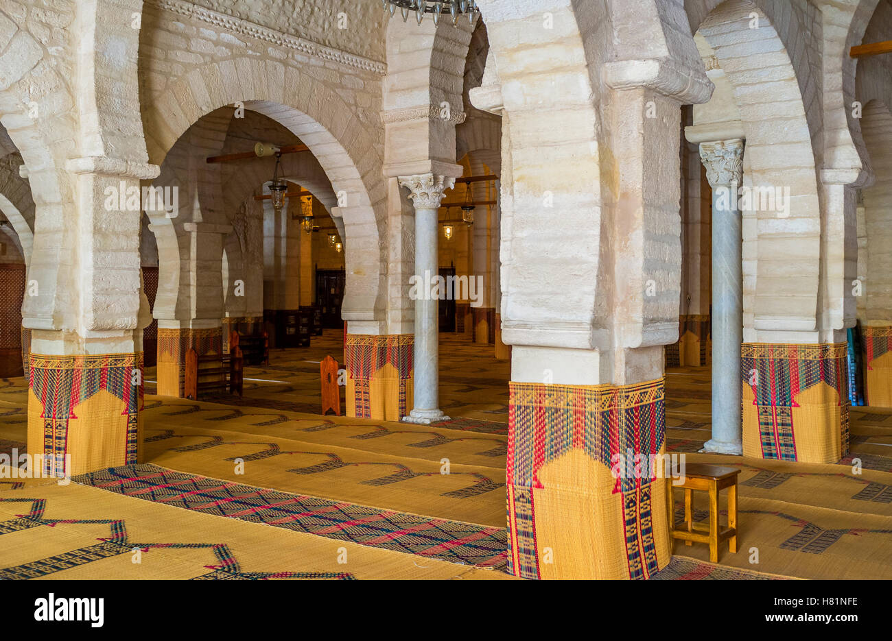 The interior of the Grand Mosque with many rows of stone arcades and ...
