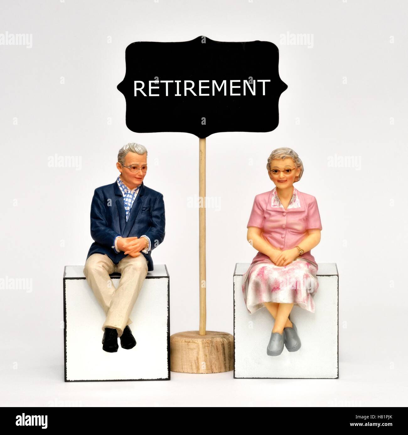 Two figurine pensioners retirement Stock Photo - Alamy