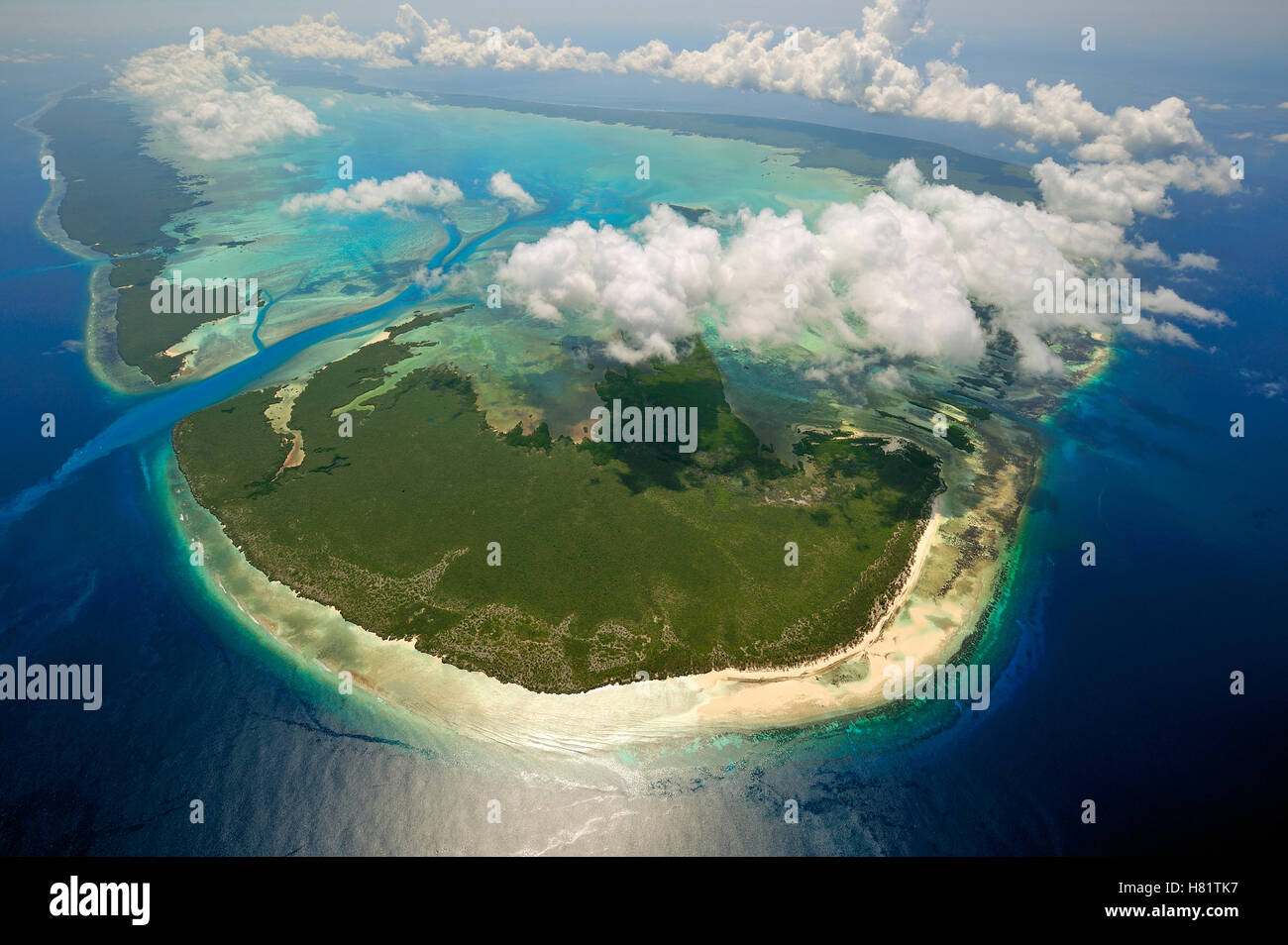 Clouds forming a ring over raised coral atoll, Aldabra, Seychelles ...