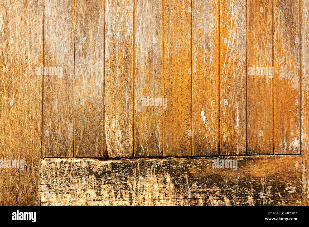 Close up of vintage neglected weathered damaged wood door panel ...