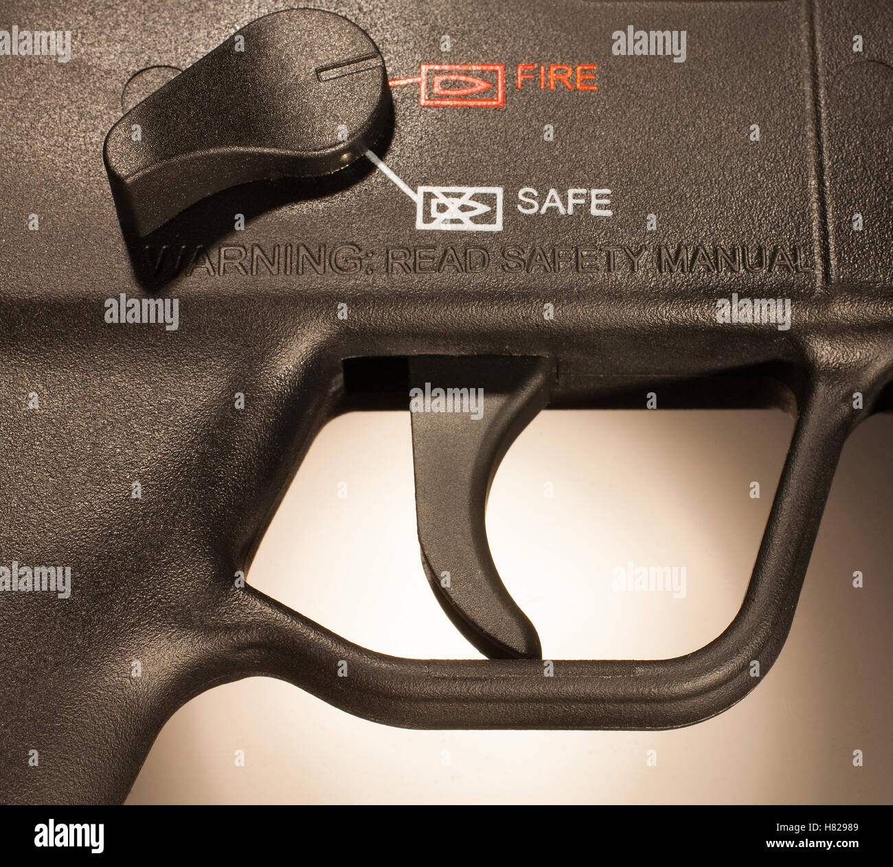 Rifle with its safety off and the trigger is seen below Stock Photo - Alamy