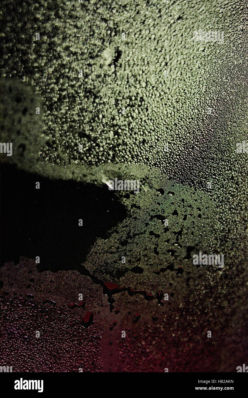 Abstract light effects on a wet glass pane with water drops Stock Photo ...