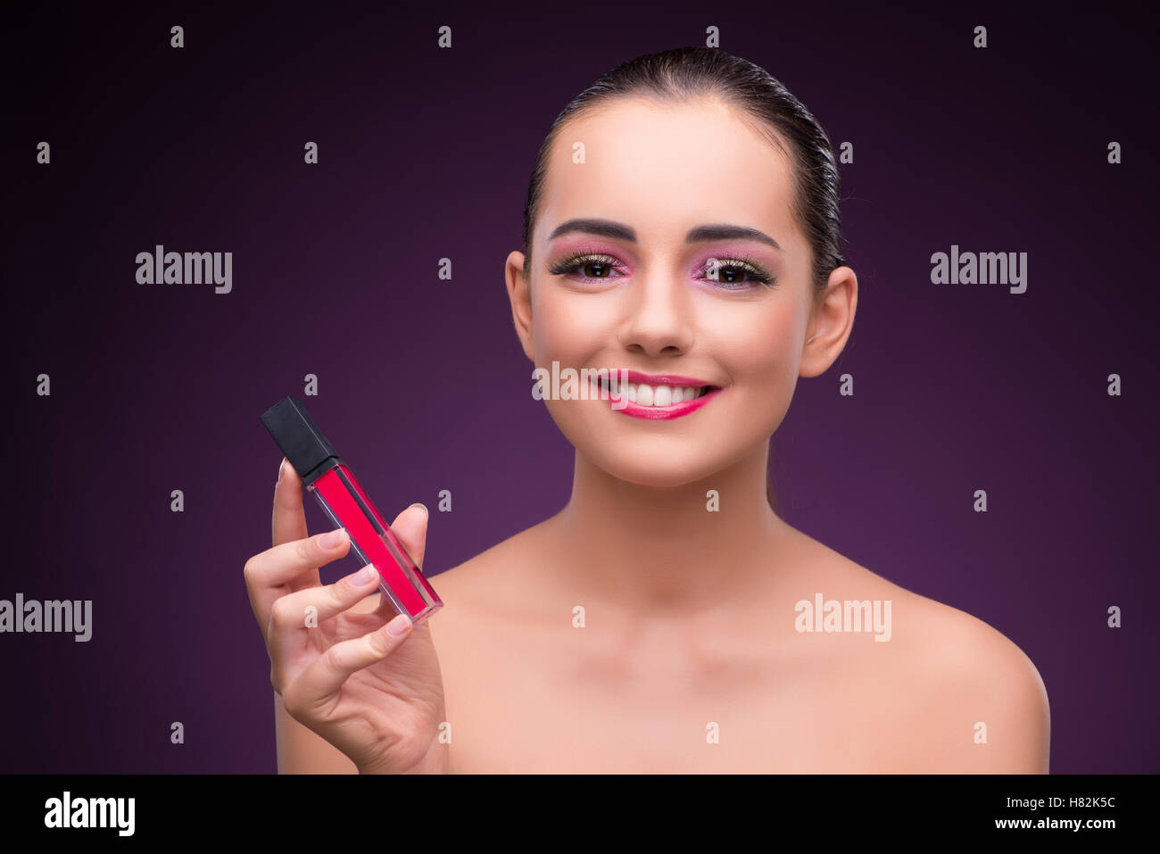 Woman with lipstick tube in beauty concept Stock Photo - Alamy