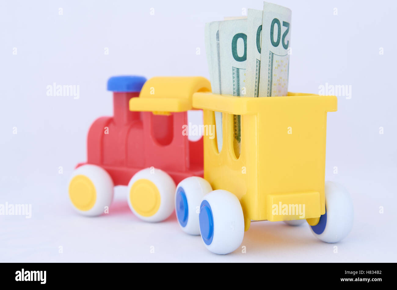 toy train pulling money Stock Photo - Alamy