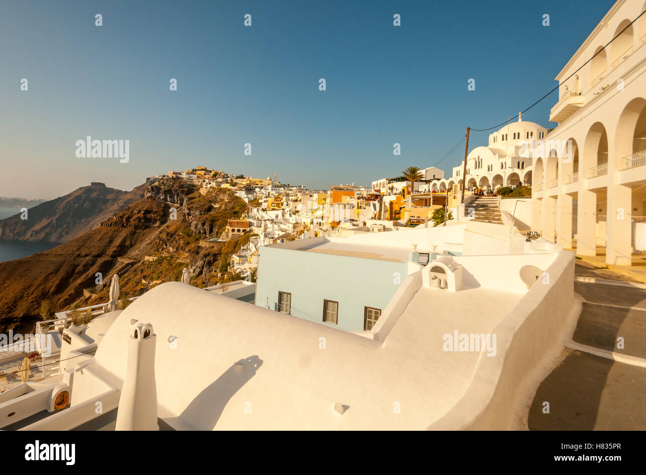 FIRA, GREECE - SEPTEMBER 28, 2011: Sunset scene in the town of Fira ...