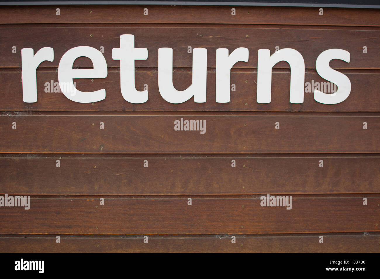 Library returns sign Stock Photo - Alamy