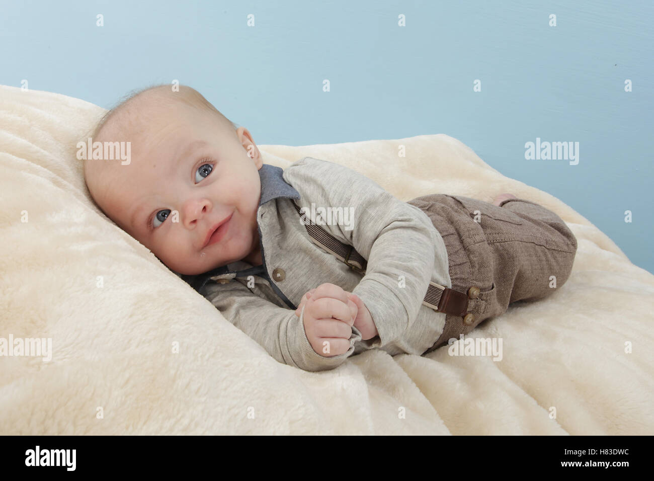 small baby boy playing on blanket Stock Photo - Alamy