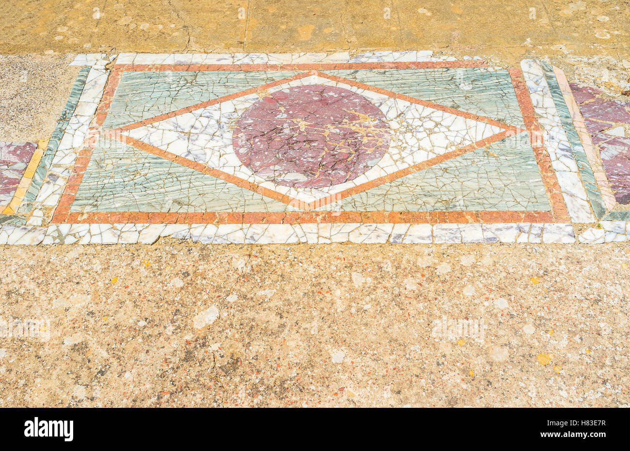 The colorful geometric pattern of the stone tiles in archaeologcal site ...