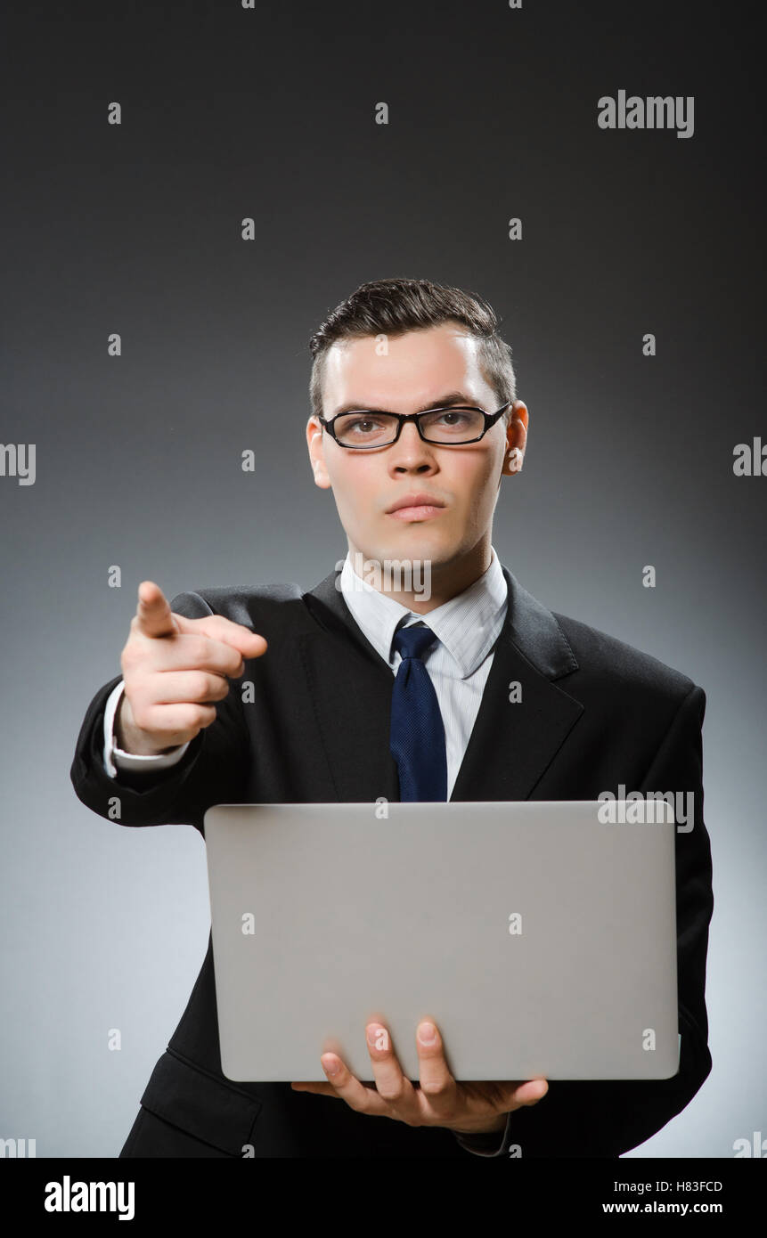 Man with laptop in business concept Stock Photo - Alamy