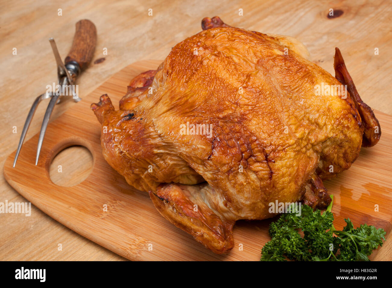 Full chicken roaster that has been freshly smoked Stock Photo - Alamy