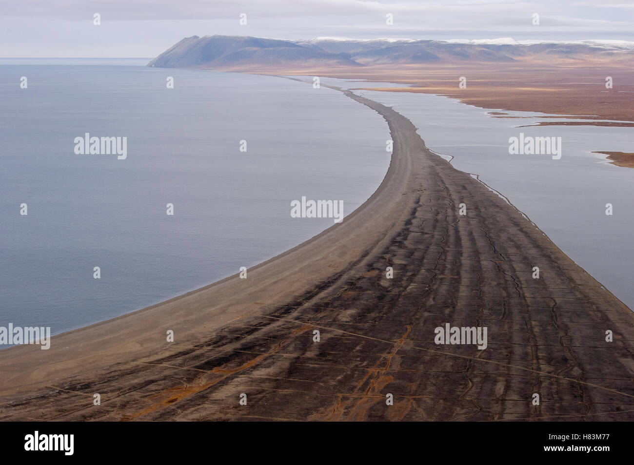 Bar beach sheltering a lagoon along shoreline, Wrangel Island, Russia ...
