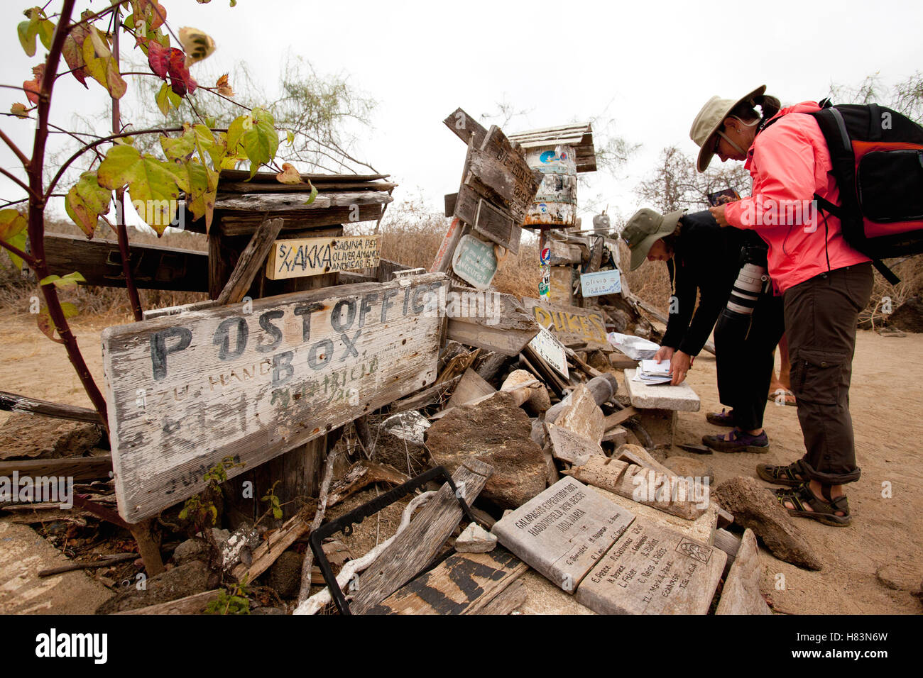 Tourists inspecting mail at postal exchange which is a tradition set up ...