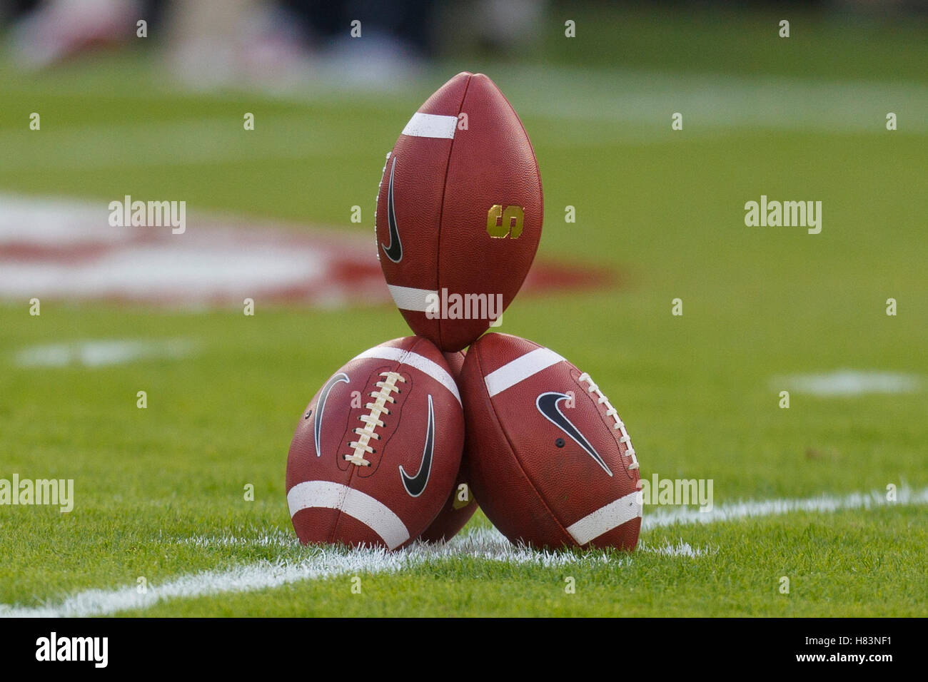 American footballs pile hi-res stock photography and images - Alamy