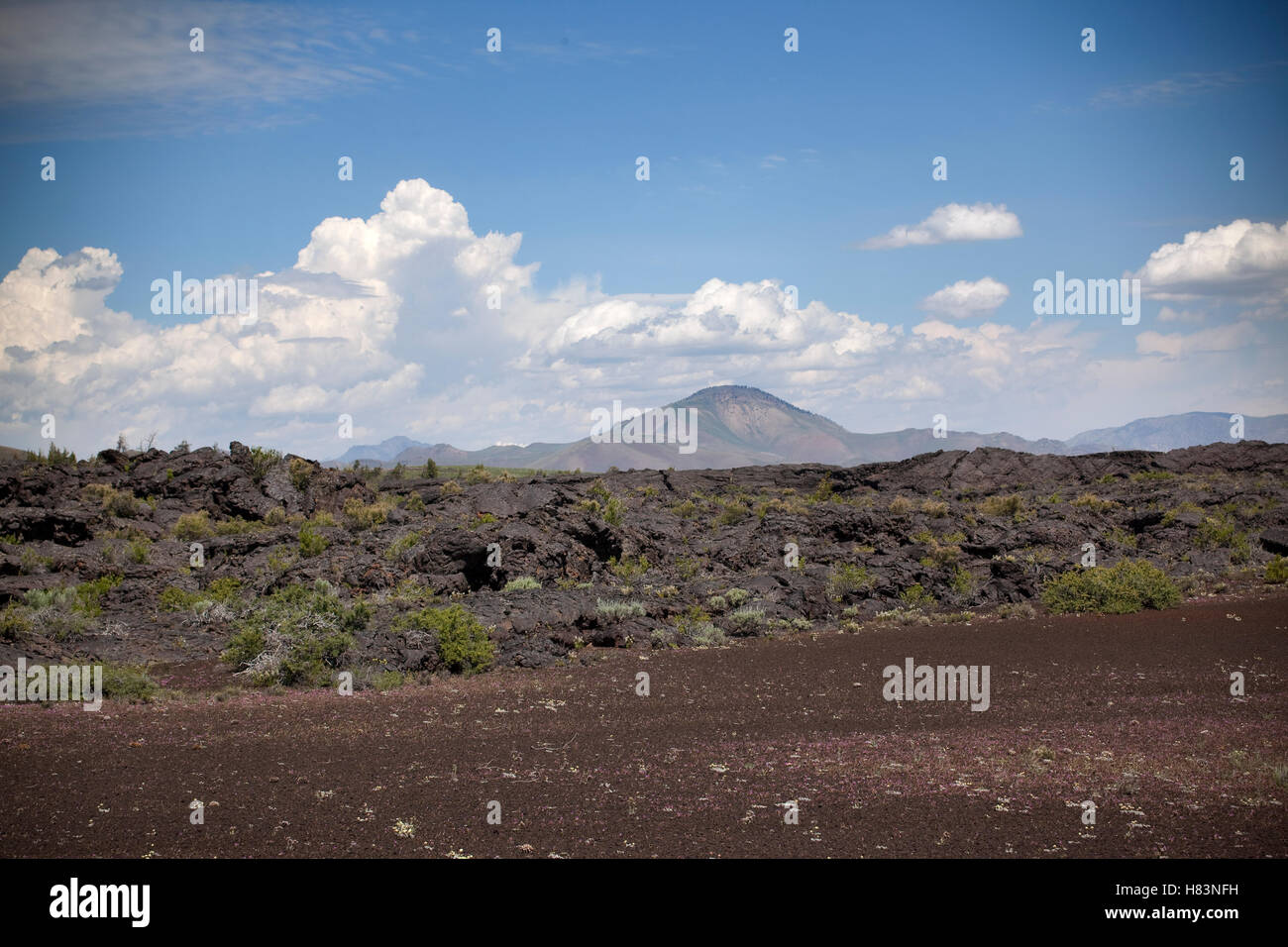 Cinder rocks and old lava flow, Craters of the Moon National Monument ...