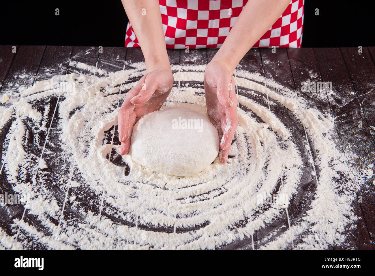 Cook preparing dough for baking in the kitchen Stock Photo - Alamy
