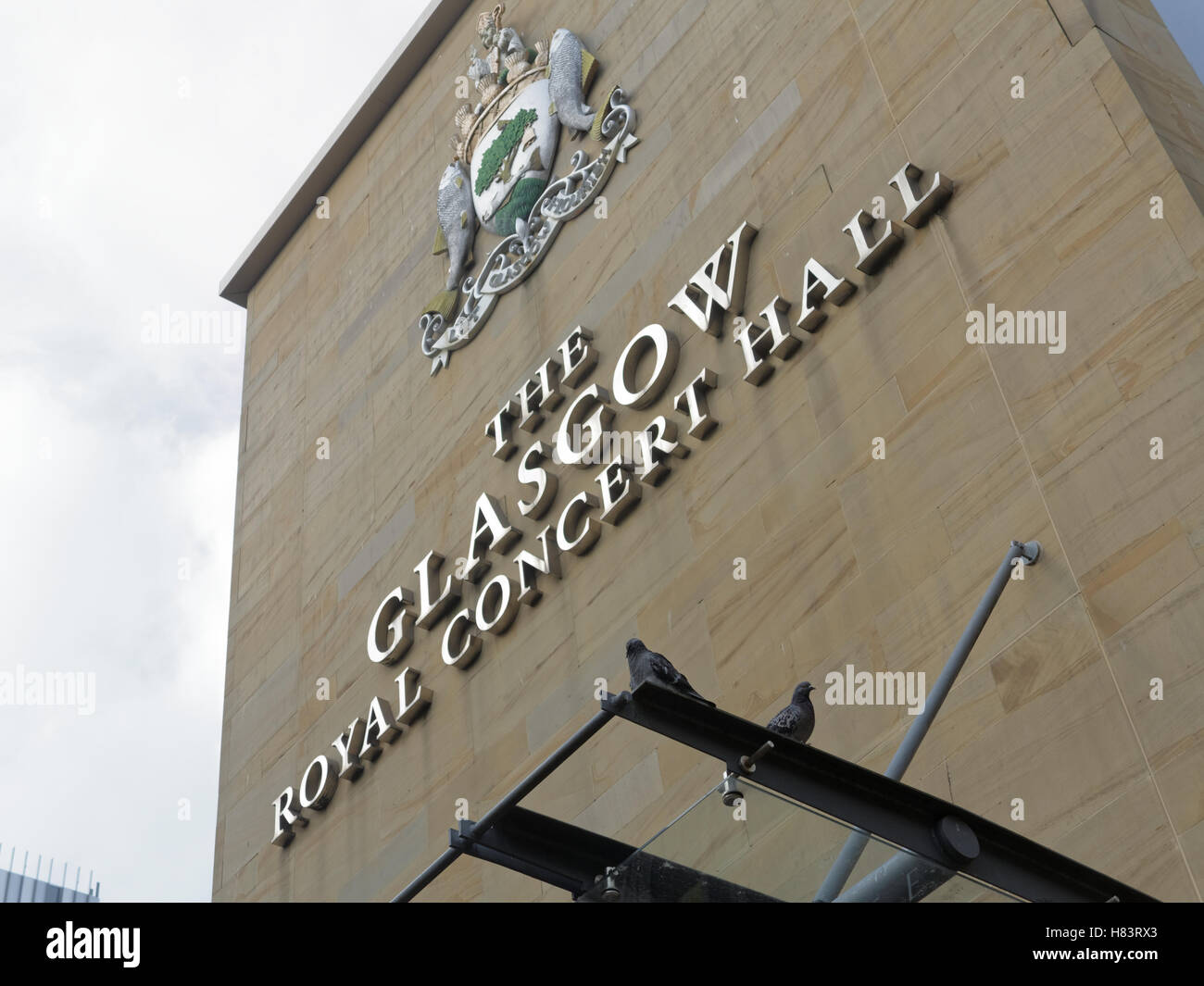Glasgow Royal Concert Hall sign with pigeons Stock Photo - Alamy