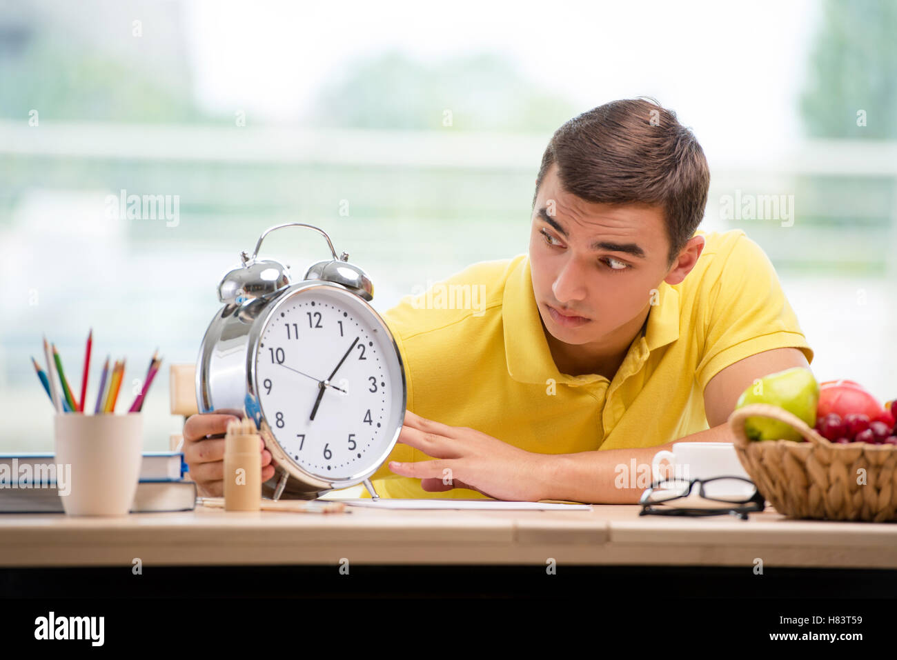 Student missing deadlines for exam preparation Stock Photo - Alamy