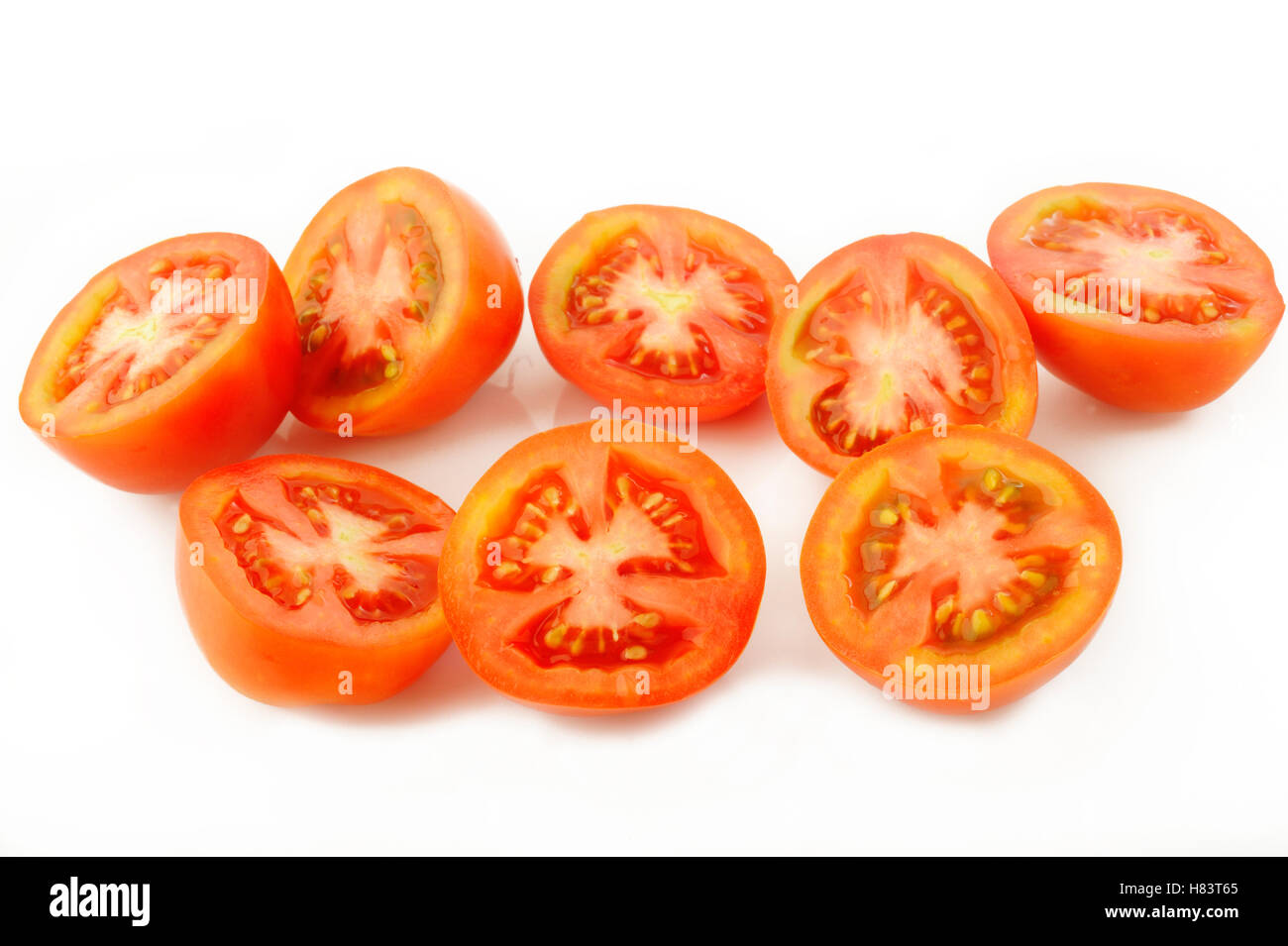 sliced tomato isolated on white background Stock Photo - Alamy