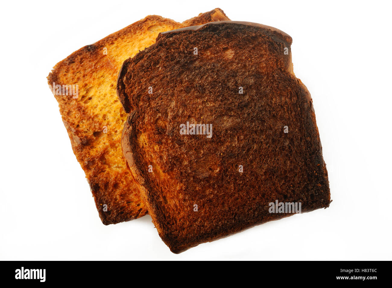 Burnt toast isolated on white background Stock Photo - Alamy