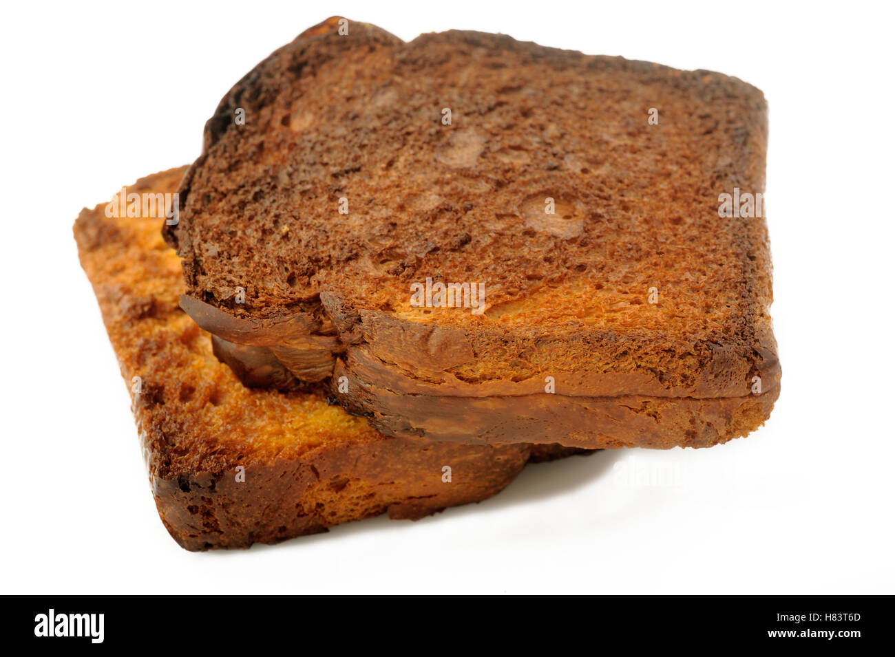 Burnt toast isolated on white background Stock Photo - Alamy