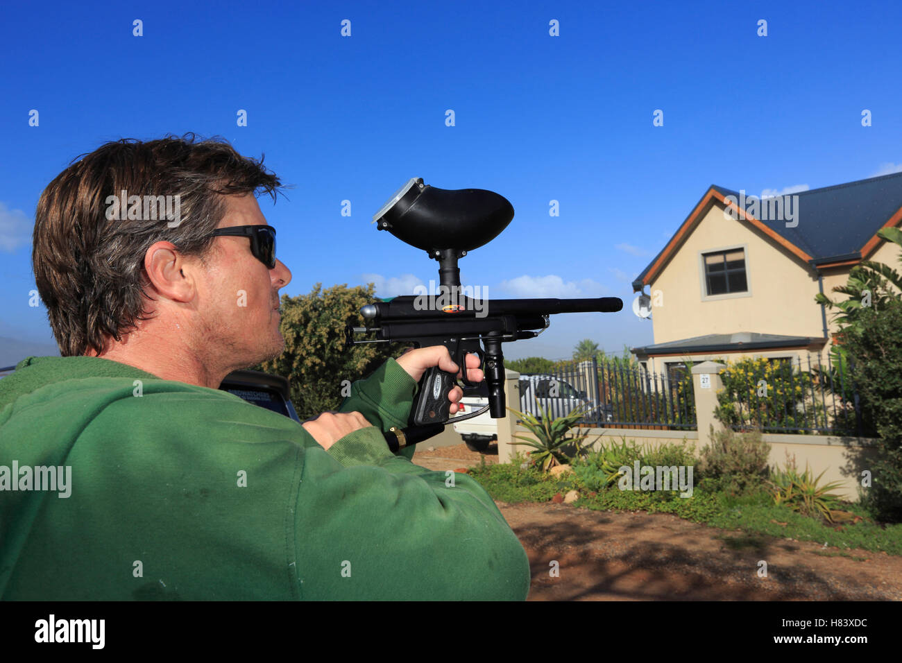 Chacma Baboon (Papio ursinus) monitor using paintball gun to deter ...