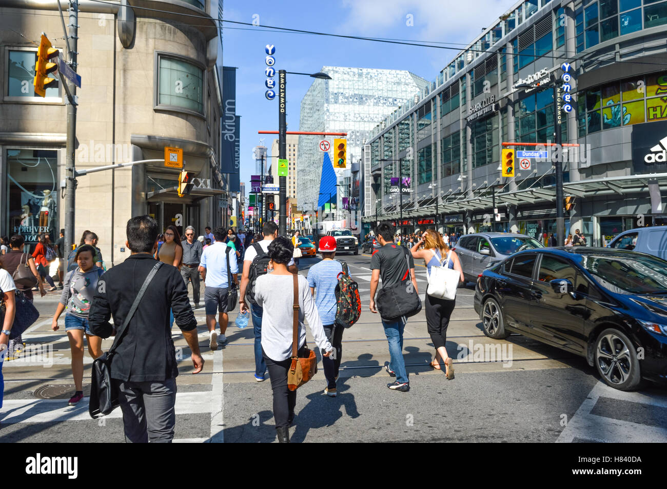TORONTO, ON, CANADA - OCTOBER 30: Pedestrians crossing a busy ...