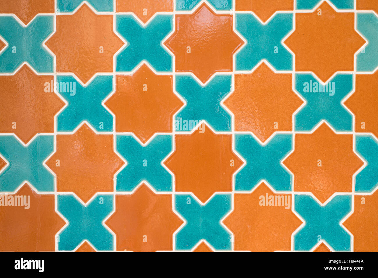 Green and orange color ceramic tile star shape Stock Photo - Alamy